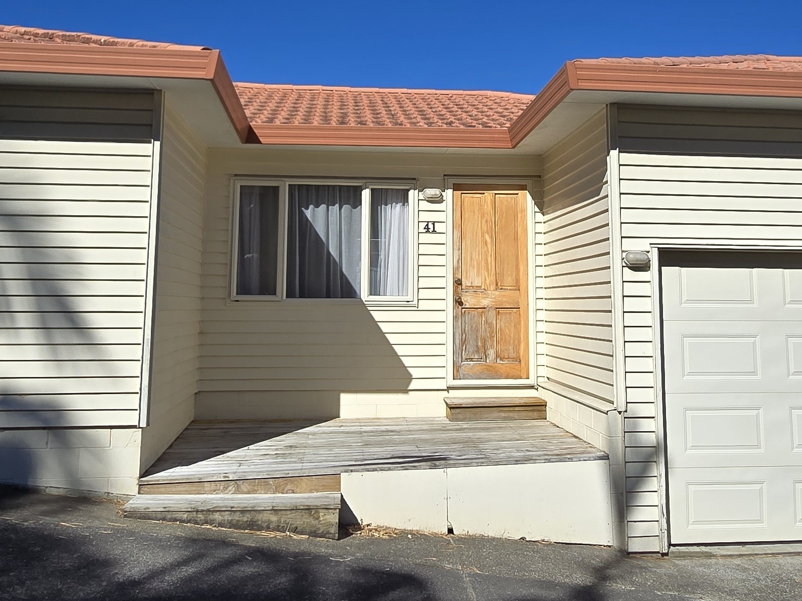 Need low cost awning / cover installed over decked front entrance ...