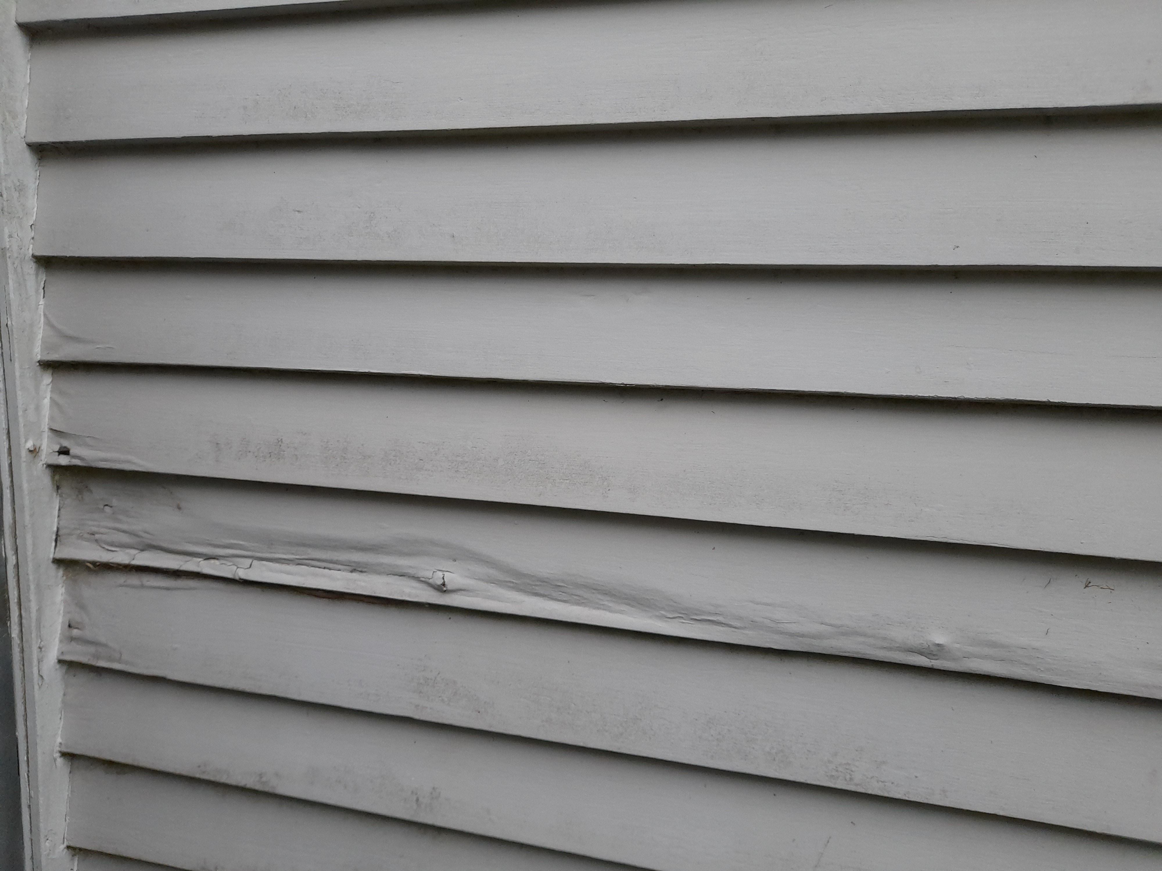 partial weatherboard replacement on side of wooden house | NoCowboys
