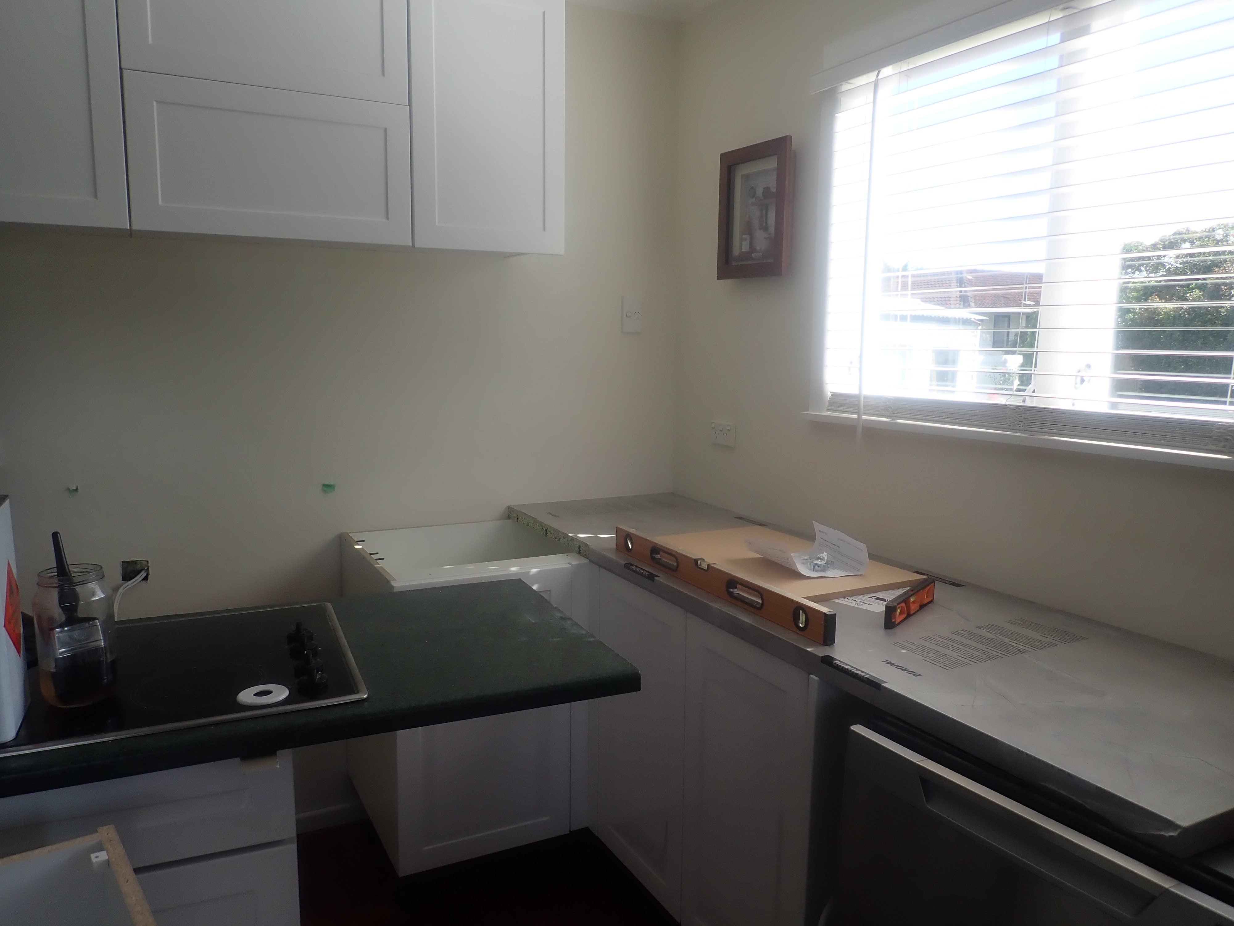 Cutting of new bench top for sink and stove top and connection of ...